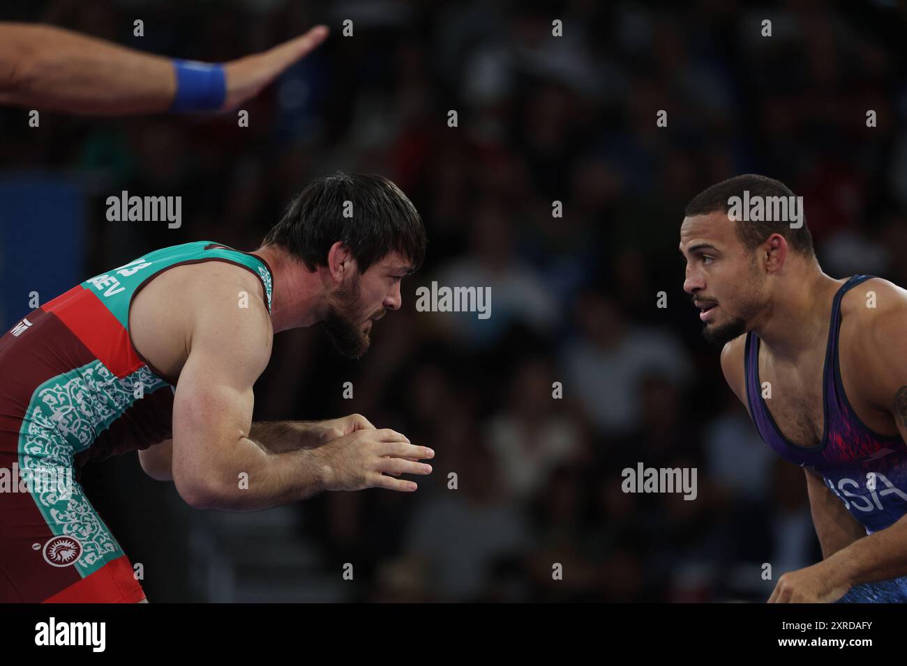 Paris, France. 09th Aug, 2024. Aaron Brooks of the US (blue) wrestles against Javrail Shapiev of ...