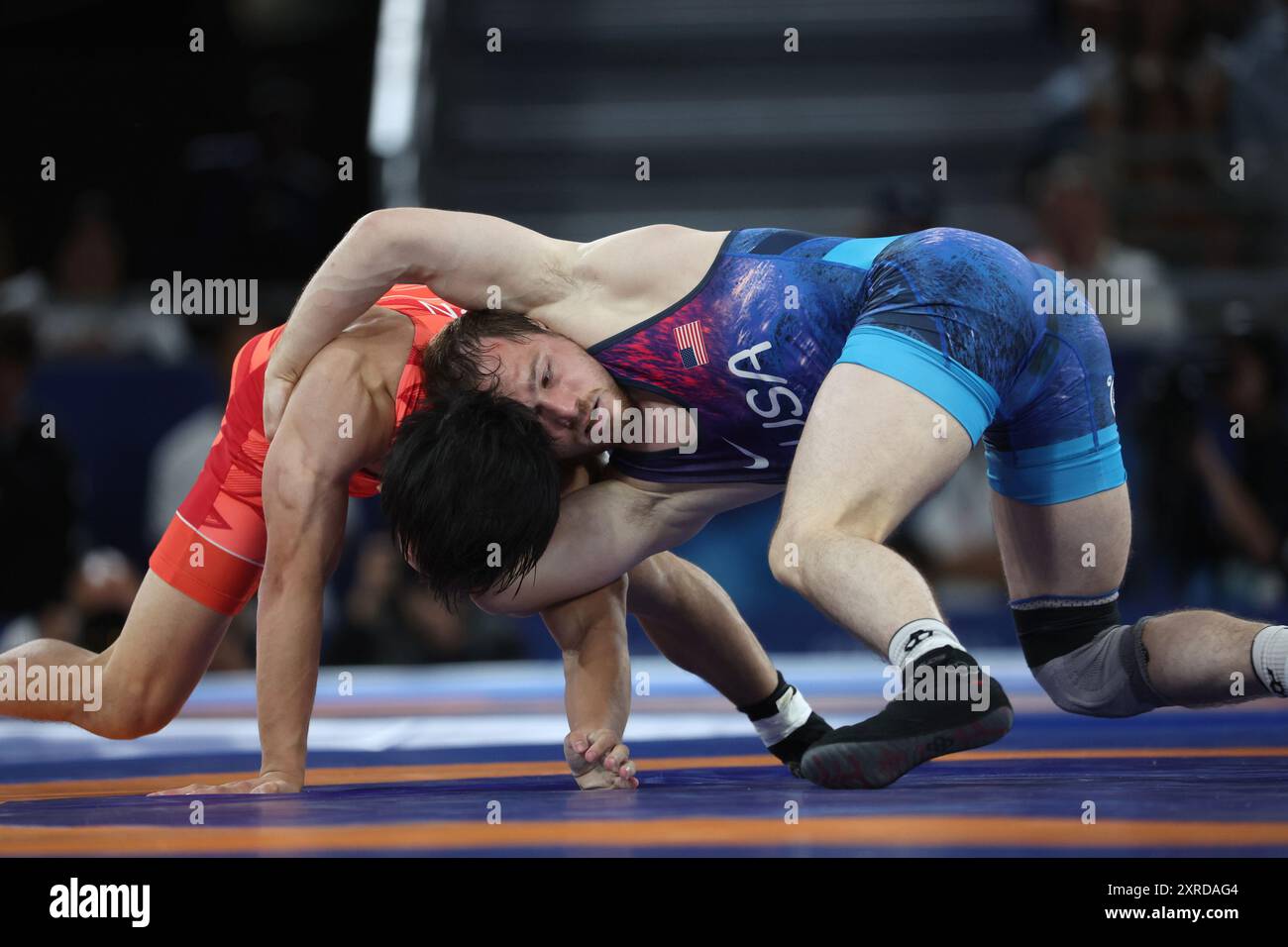 Paris, France. 09th Aug, 2024. Spencer Lee of the US (blue) wrestles against Rei Higuchi of ...