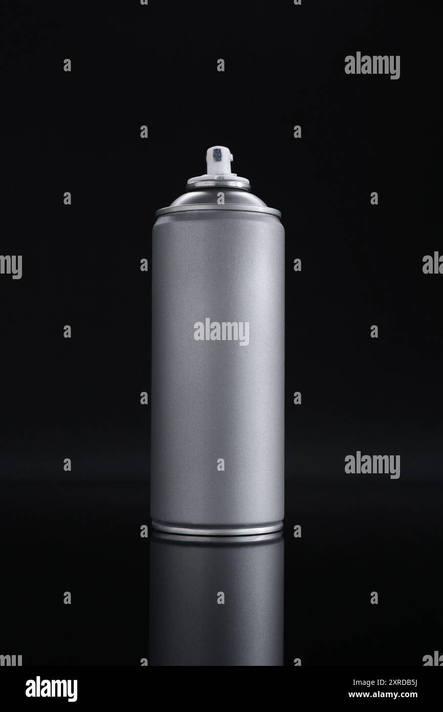 Gray spray paint can on black background Stock Photo - Alamy