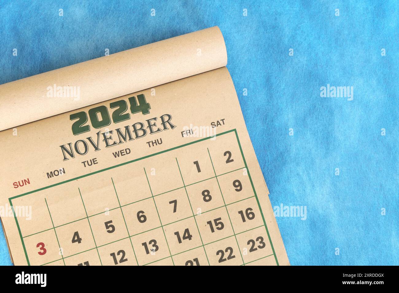 November 2024 calendar flat lay in blue background with copy space ...
