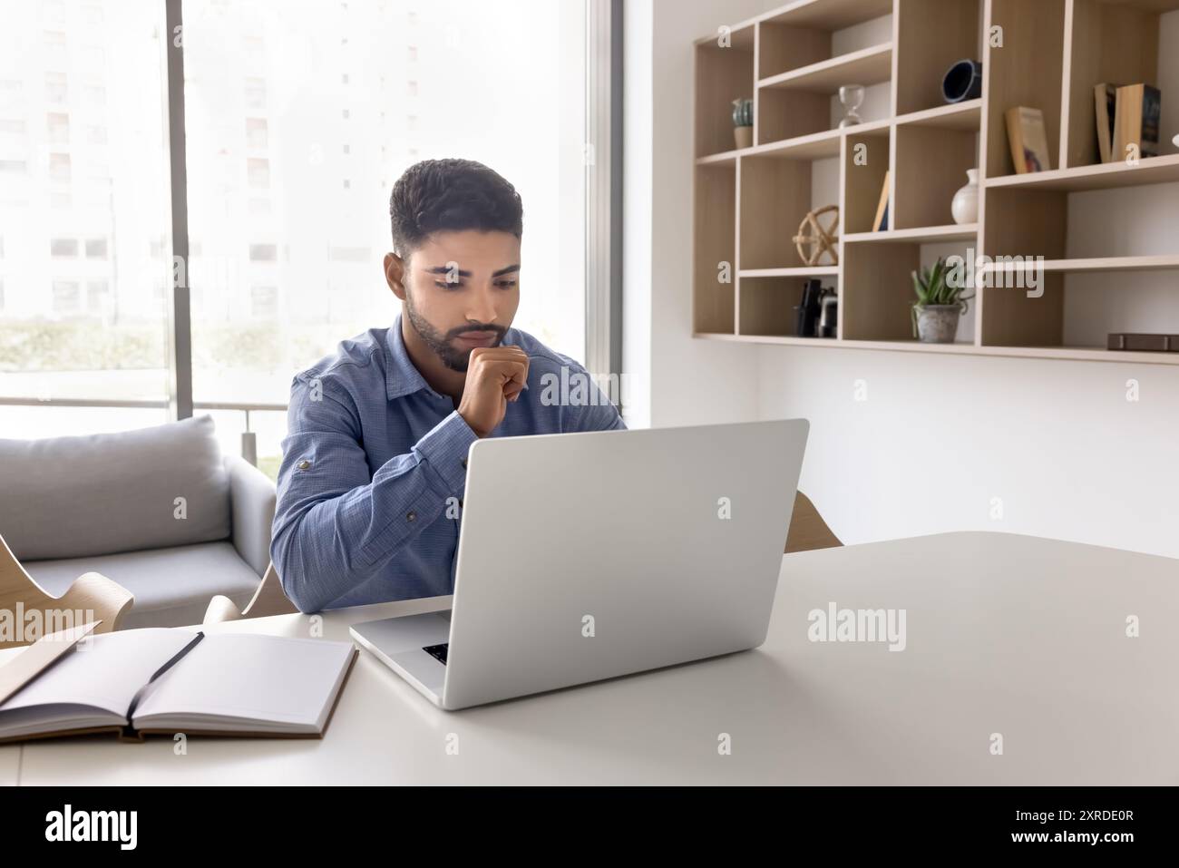 Serious young arab employee hi-res stock photography and images - Alamy