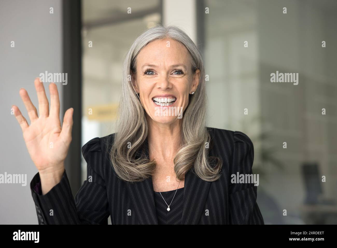 Hello senior businesswoman waving hand hi-res stock photography and ...