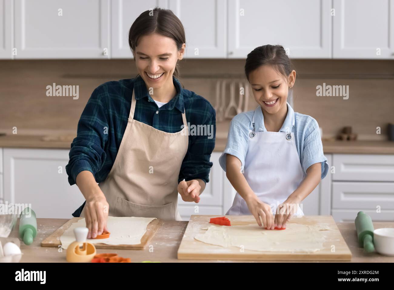 Happy mom and cute kid girl baking cookies Stock Photo - Alamy