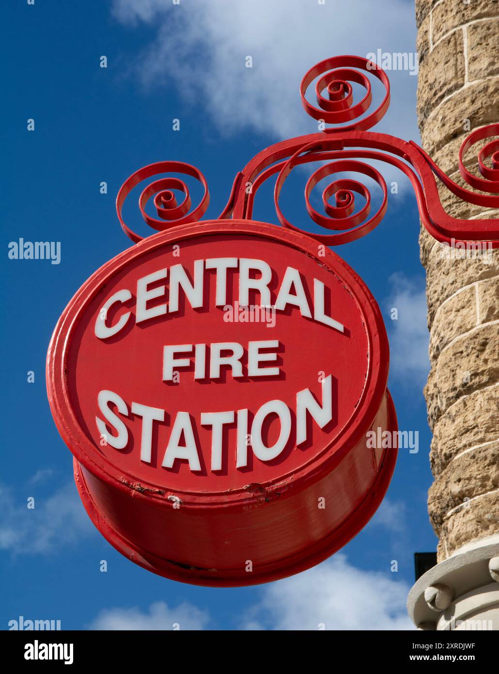 A bright red antique fire station sign on an old building Stock Photo ...
