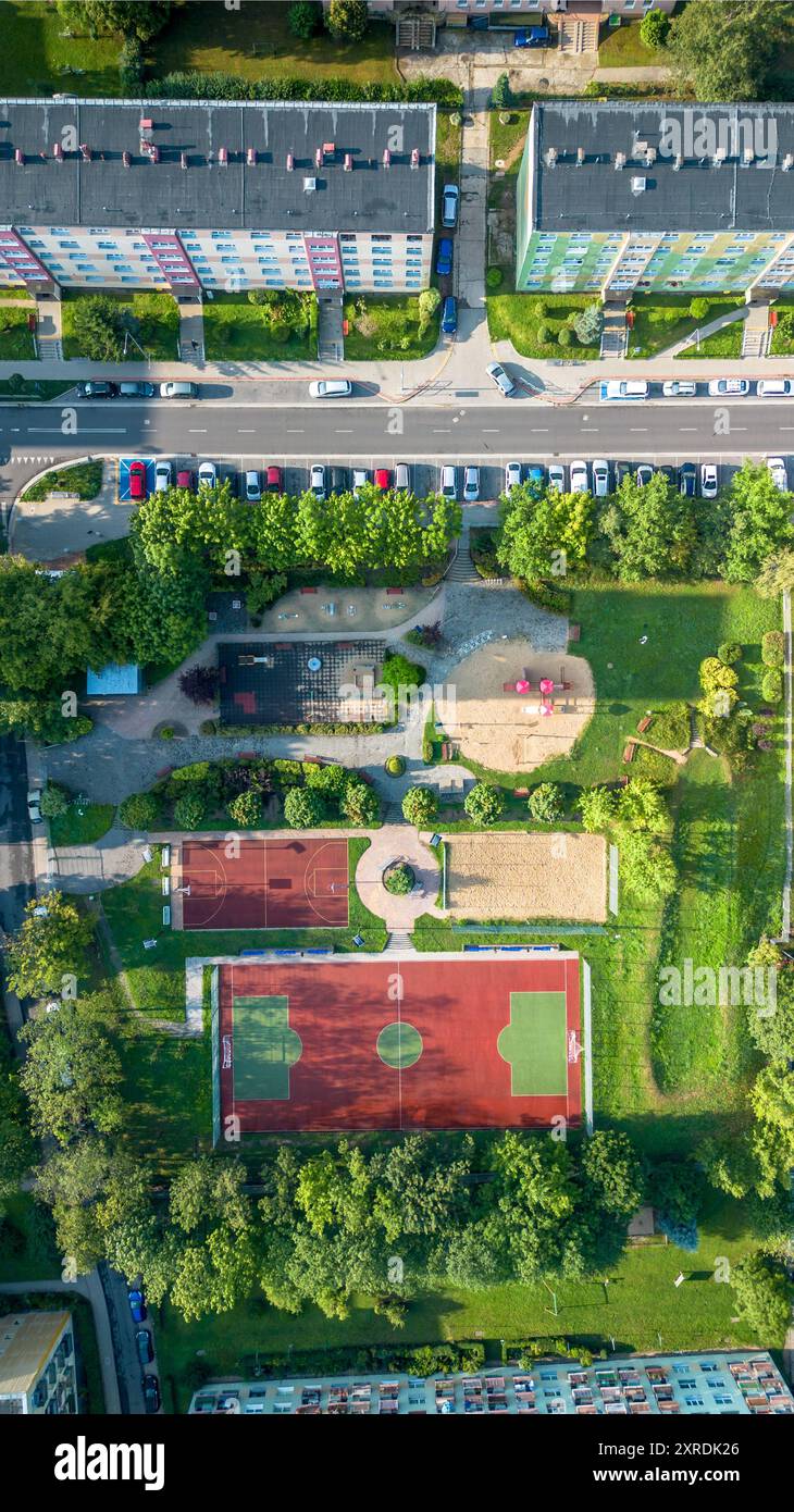 Aerial view of a community park with sports courts and green spaces in ...