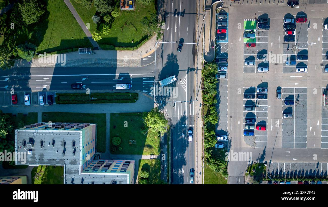 Aerial view of a busy intersection and parking lot in an urban area ...