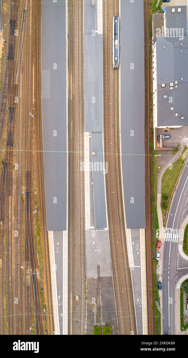 Aerial view of a train station with multiple tracks and a train at the ...