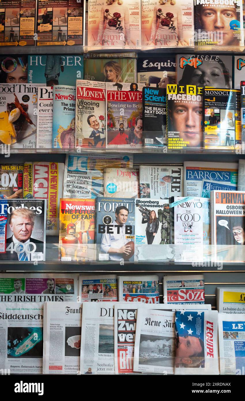 Magazine rack with international newspapers and mags. Newsstand ...