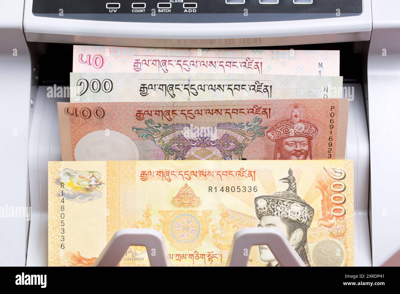 Bhutanese money - ngultrum in the counting machine Stock Photo - Alamy