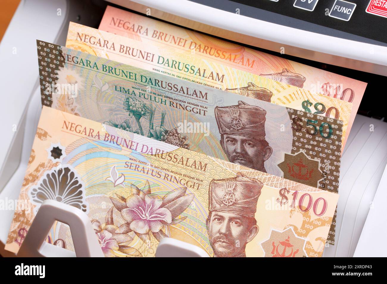 Brunei money - dollar in the counting machine Stock Photo - Alamy