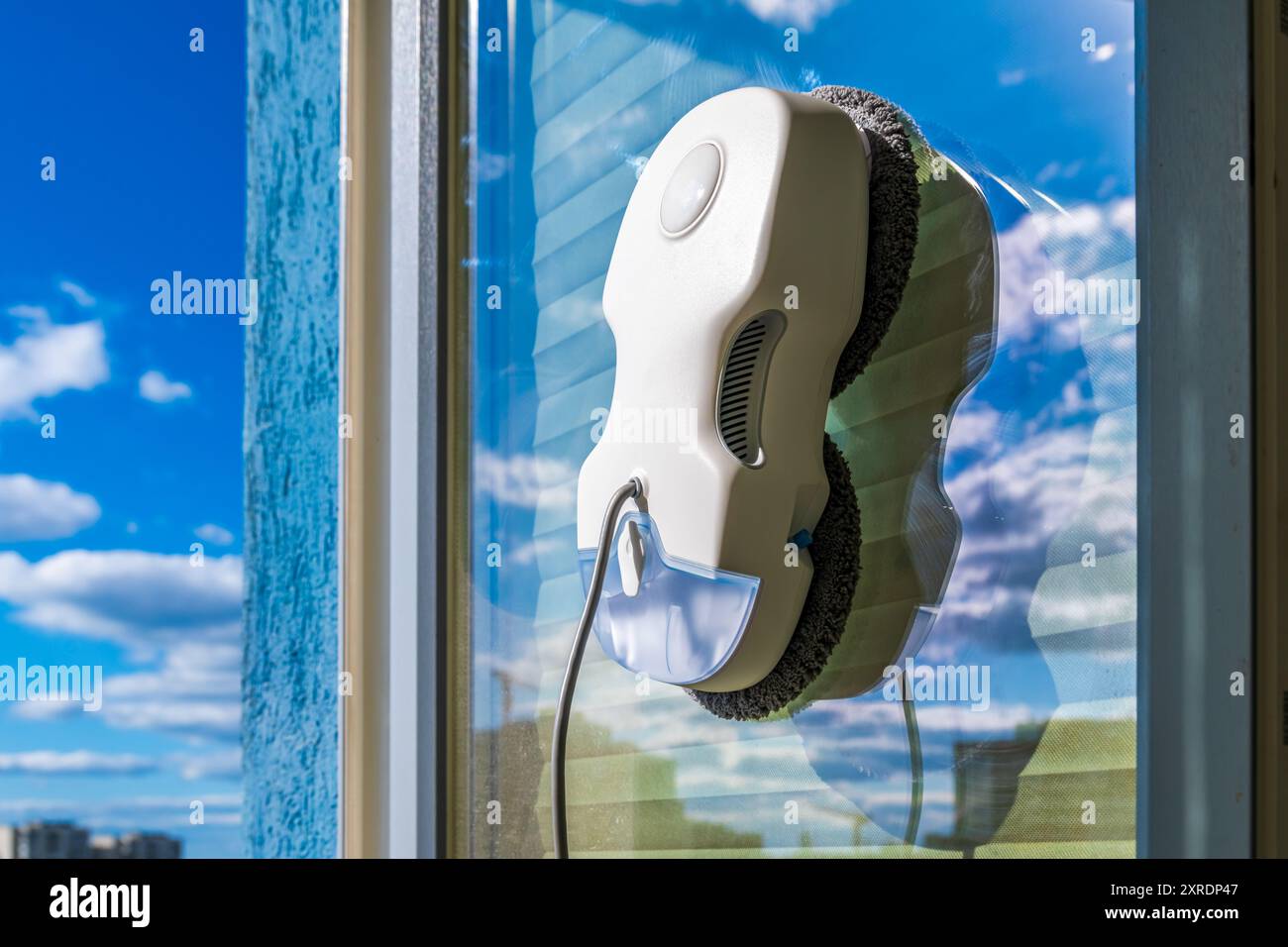 Robot window cleaner washes glass with round rags, robotic service ...