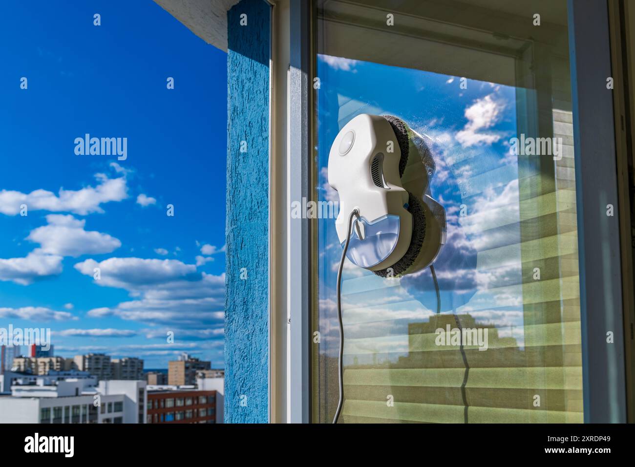 Robot window cleaner washes glass with round rags, robotic service ...
