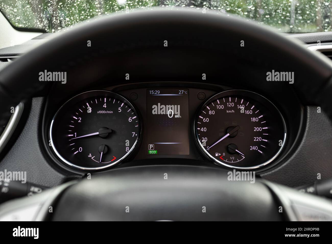 Close-up of round dashboard; speedometer and tachometer with white ...