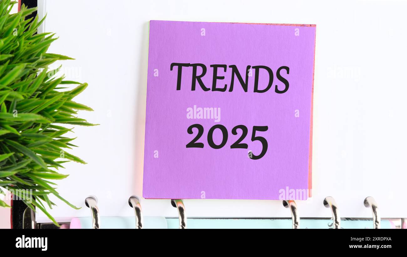 Trend 2025 on a purple sticker on the background of a blank sheet of a ...