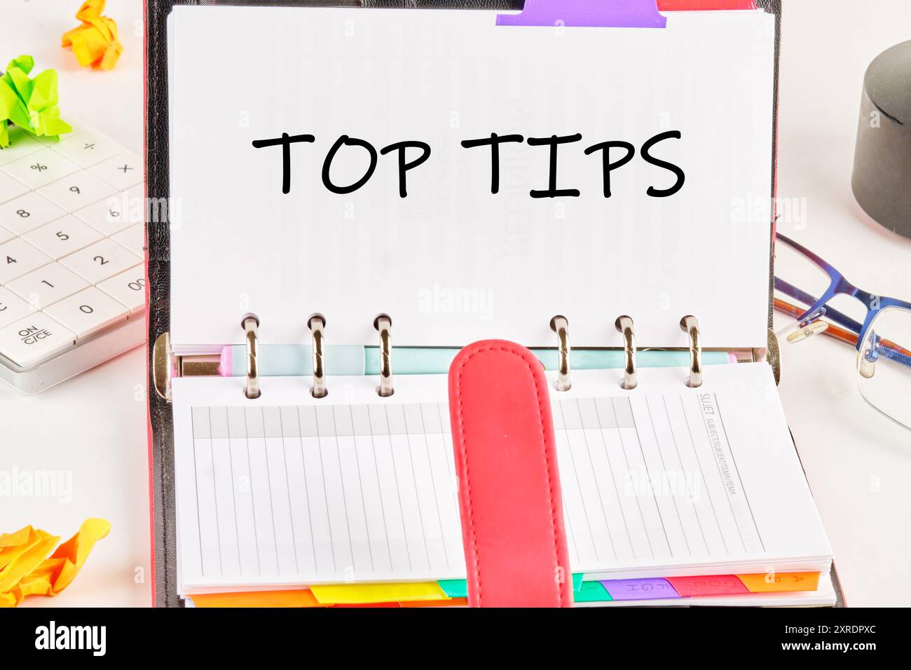 Top tips. Inscription TOP TIPS word in an open notebook on a white ...