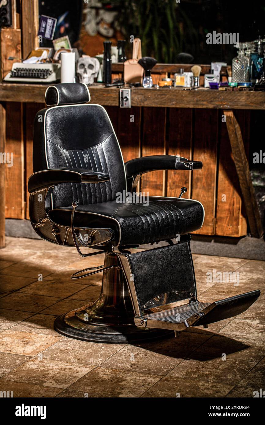 Stylish vintage barber chair. Professional hairstylist in barbershop ...