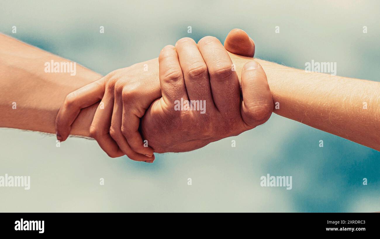 Couple of helping and praying hand on sky background. Giving a helping ...