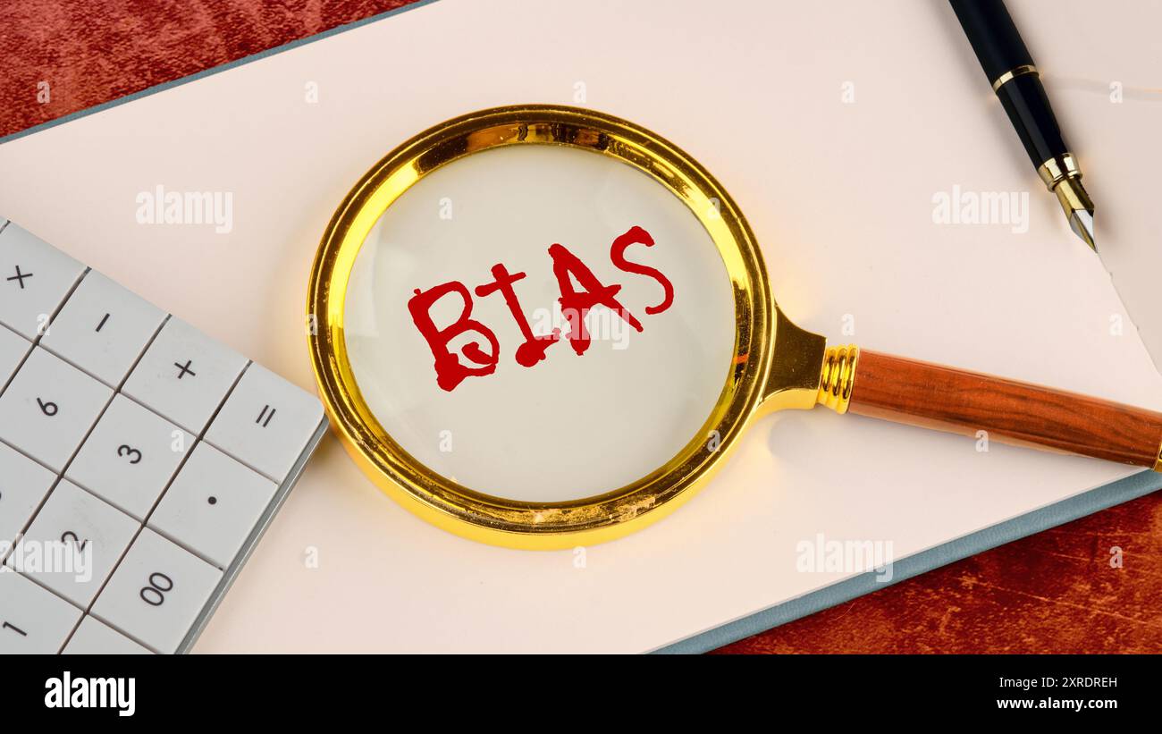 Business concept. The word Bias written through a magnifying glass in ...