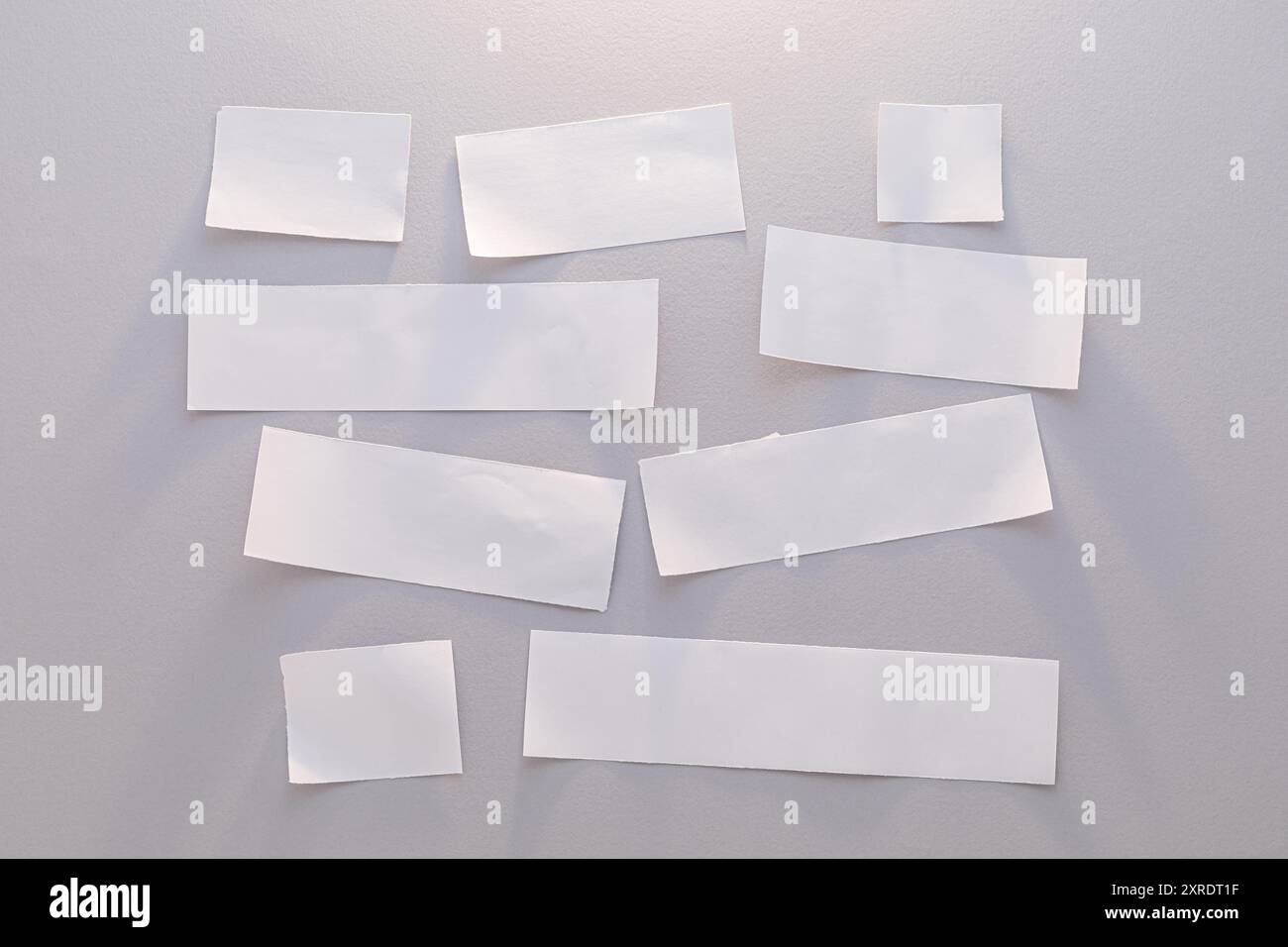 Various paper notes arranged on light background with ample copy space ...