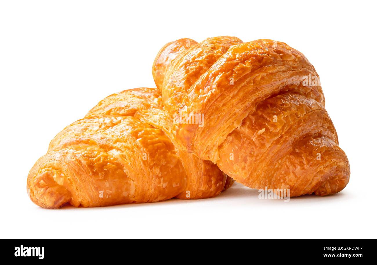 Side view of two pieces of brown or golden croissants in stack is ...