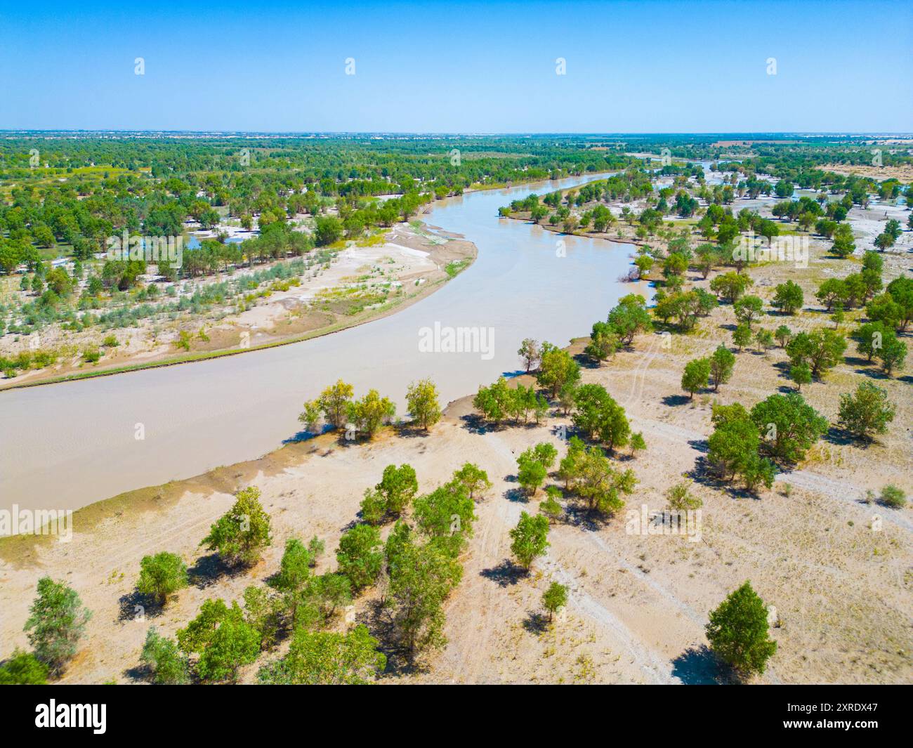 BAZHOU, CHINA - AUGUST 9, 2024 - The meandering Tarim River nourishes ...
