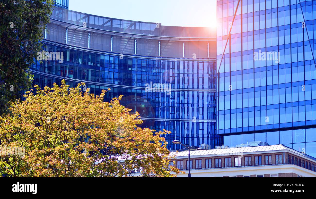 City life, urban landscape and ecology. Modern office complex with ...