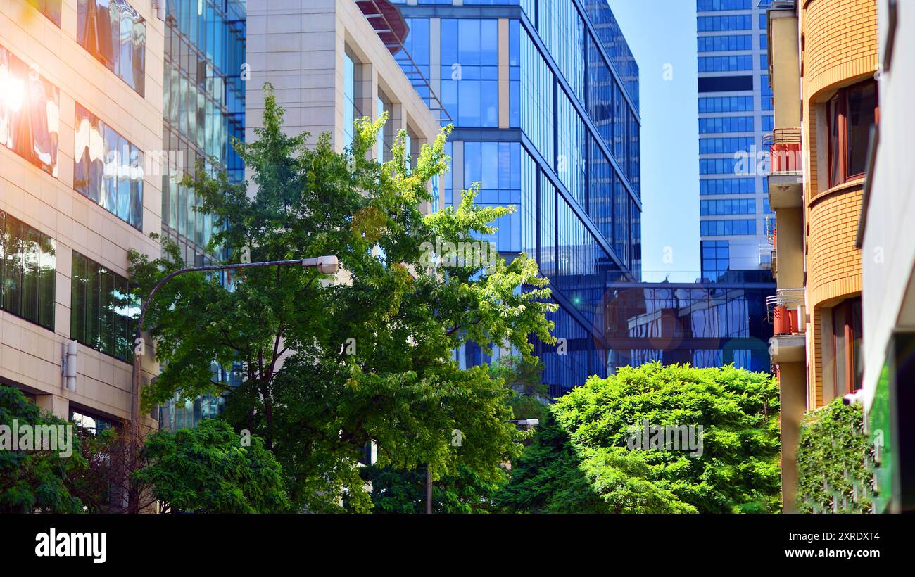 City life, urban landscape and ecology. Modern office complex with ...