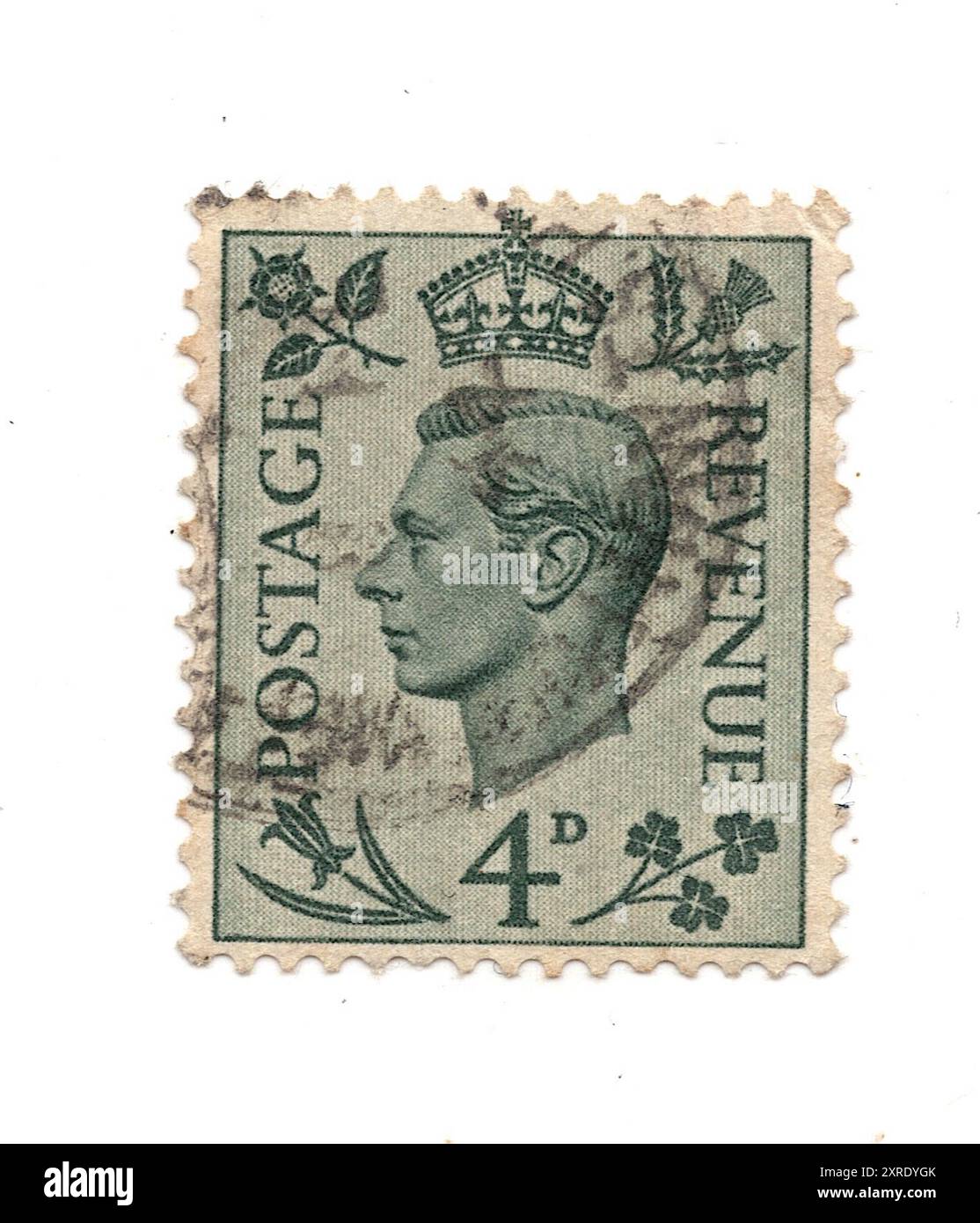 A vintage king George VI postage stamp from Great Britain on a white ...