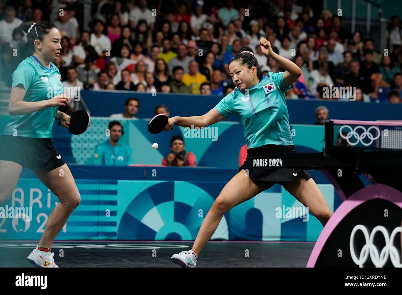 South Korea's Shin Yubin, right, and Jeon Jihee play against Germany's ...