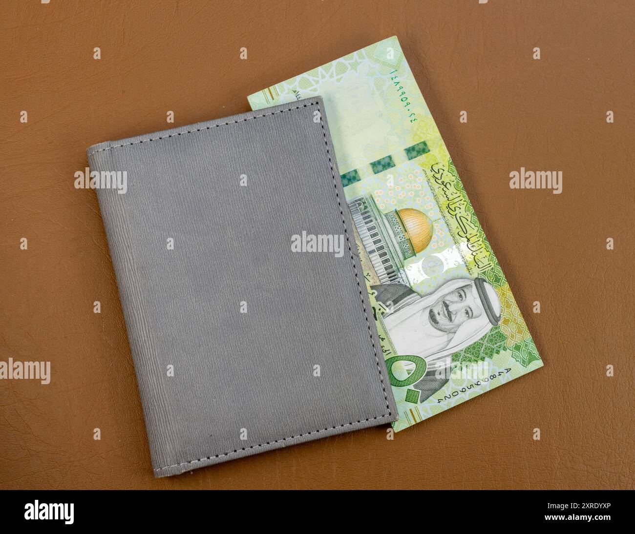 Saudi Arabia fifty riyals banknote in a wallet on brown leather ...