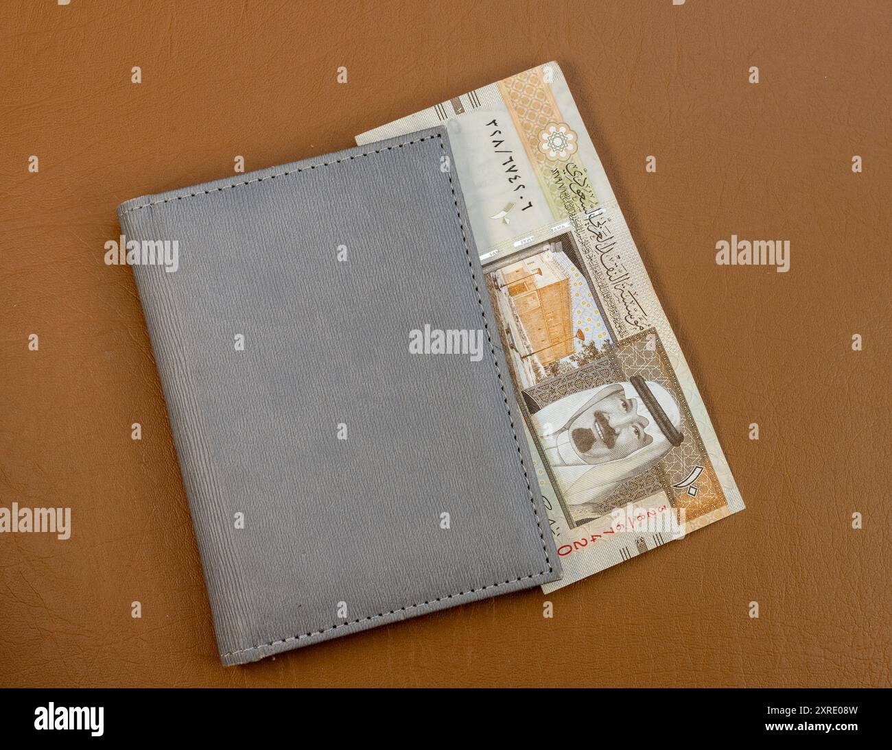 Saudi Arabia 10 riyal banknote on a leather surface Stock Photo - Alamy