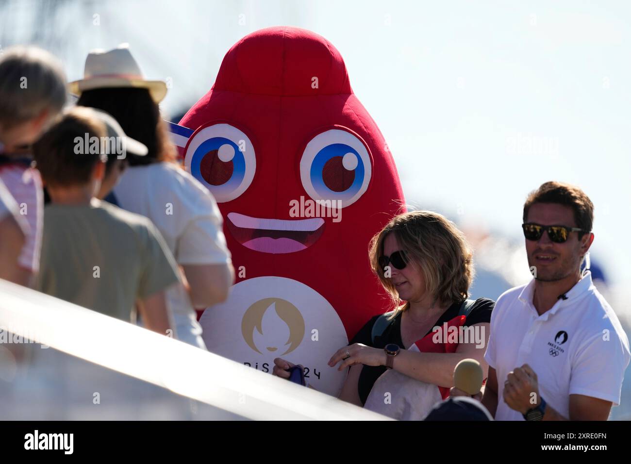 Fans surround Phryge, the Olympic mascot, ahead of canoe sprint ...