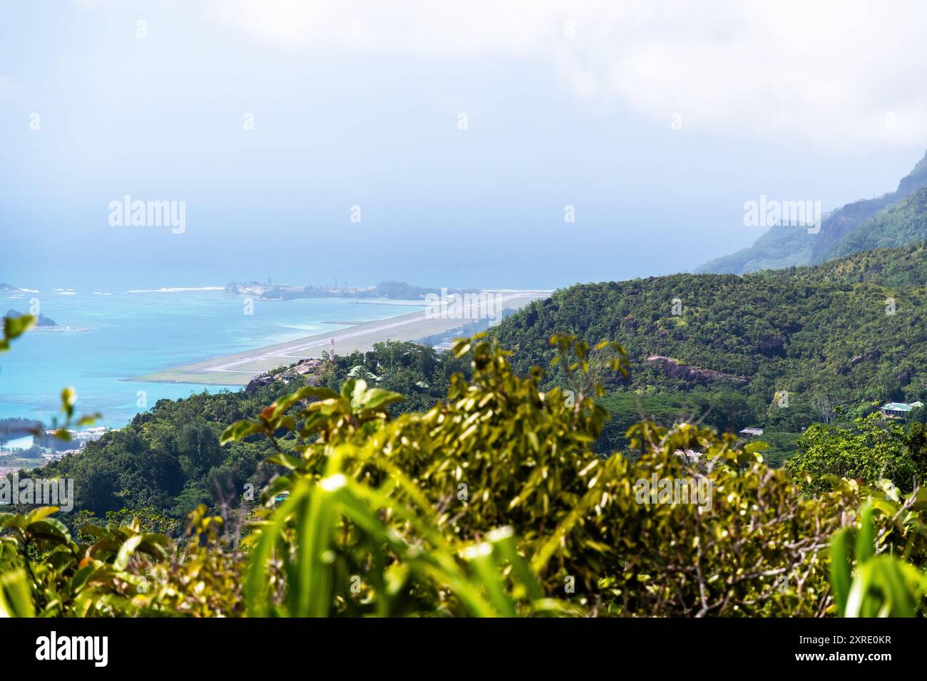 Aerial view of a Seychelles island airport runway with lush green ...