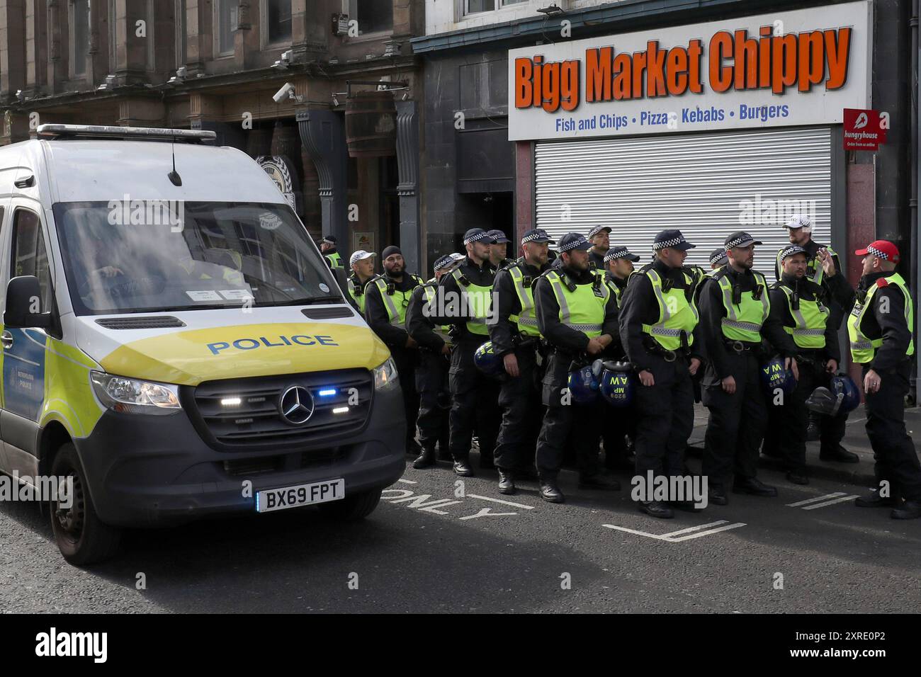 Police forces with riot gear prepare for a far-right anti-immigration ...