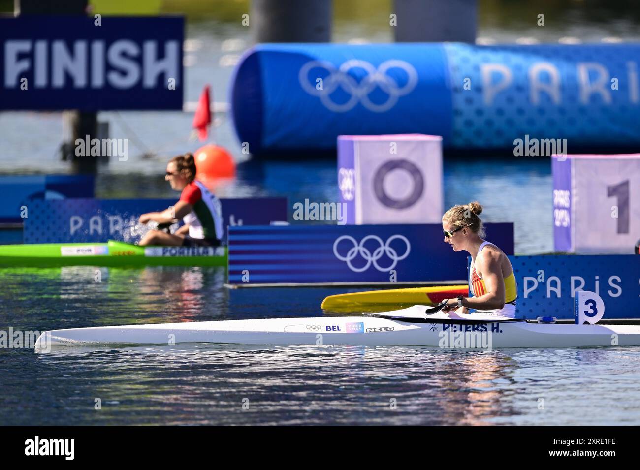 Belgian kayaker Hermien Peters crosses the finish line of the women's ...