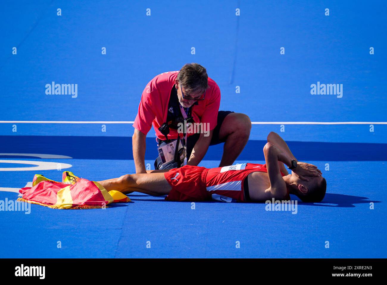 North Macedonia's Dario Ivanovski grimaces in pain after crossing the ...