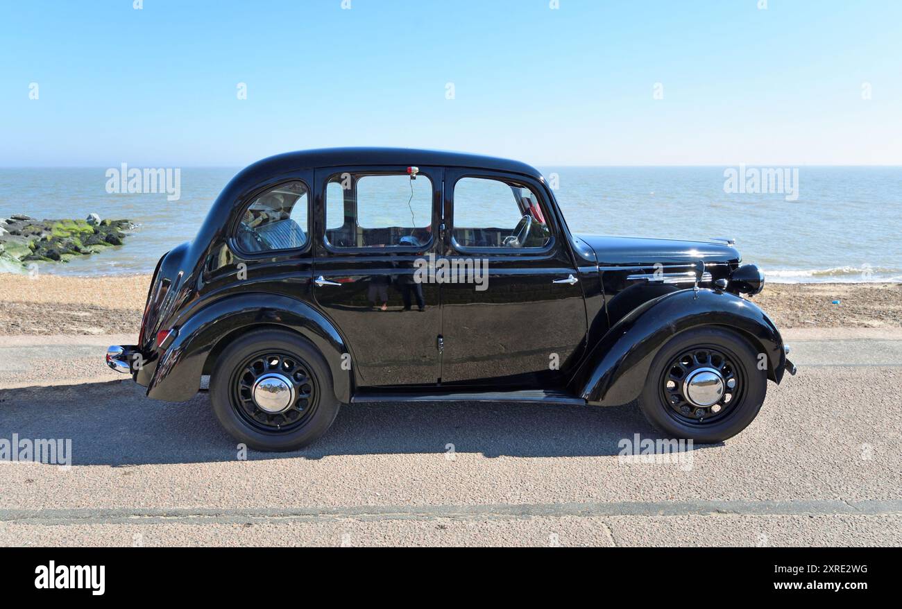 Classic Black Austin 8 Saloon parked on seafront promenade beach and ...