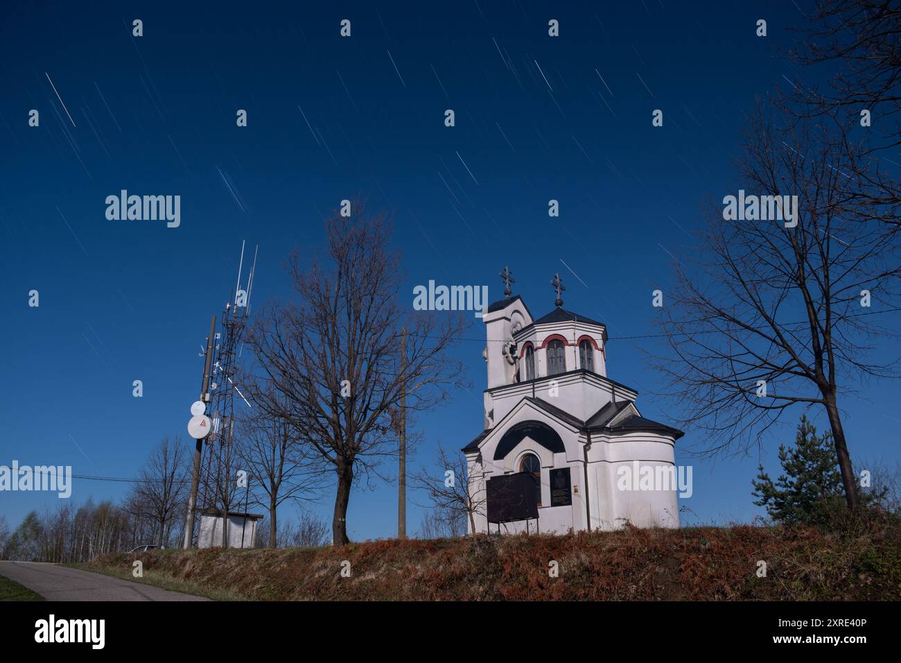 Orthodox church at night with star trails in sky Stock Photo - Alamy
