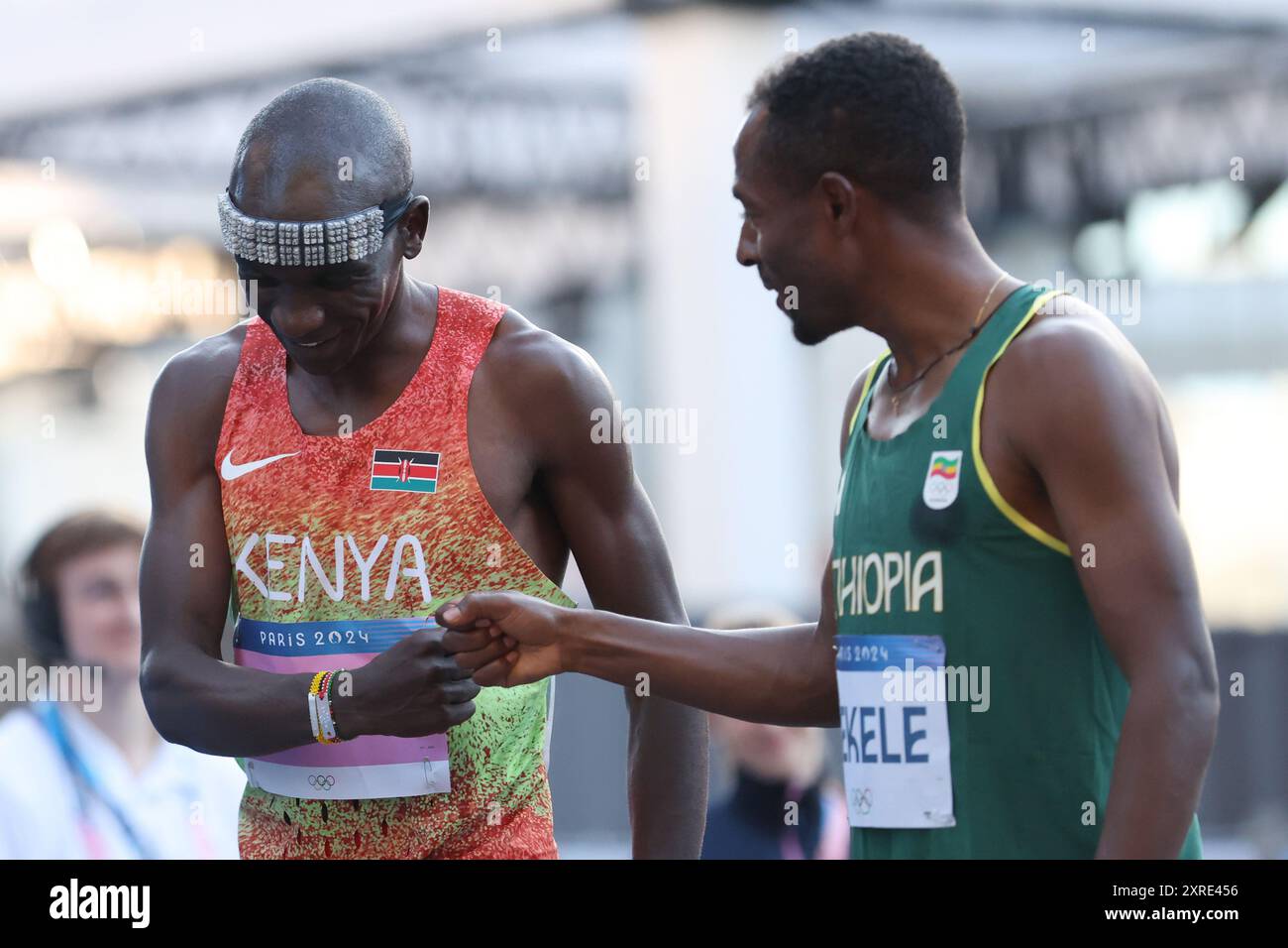 Paris, France. 10th Aug, 2024. Eliud Kipchoge (L) of Kenya fists with ...