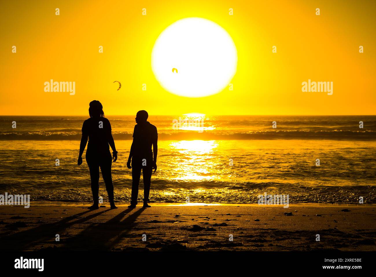 Golden sunset waves on beach hi-res stock photography and images - Alamy