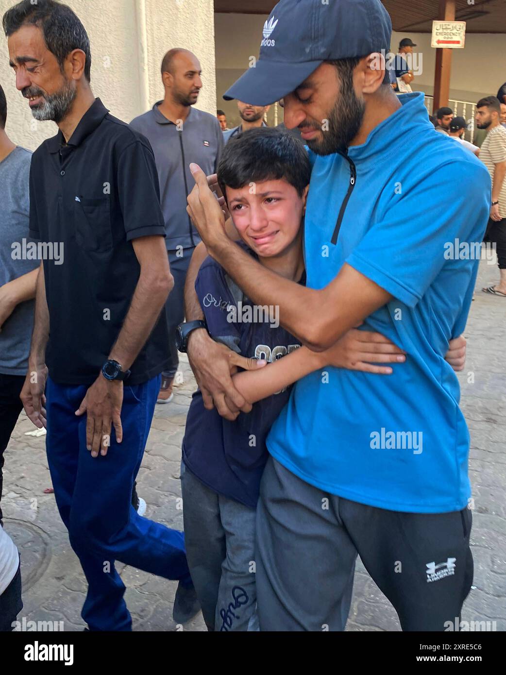 Shrouded bodies are laid down at the al-Maamadani hospital, following ...