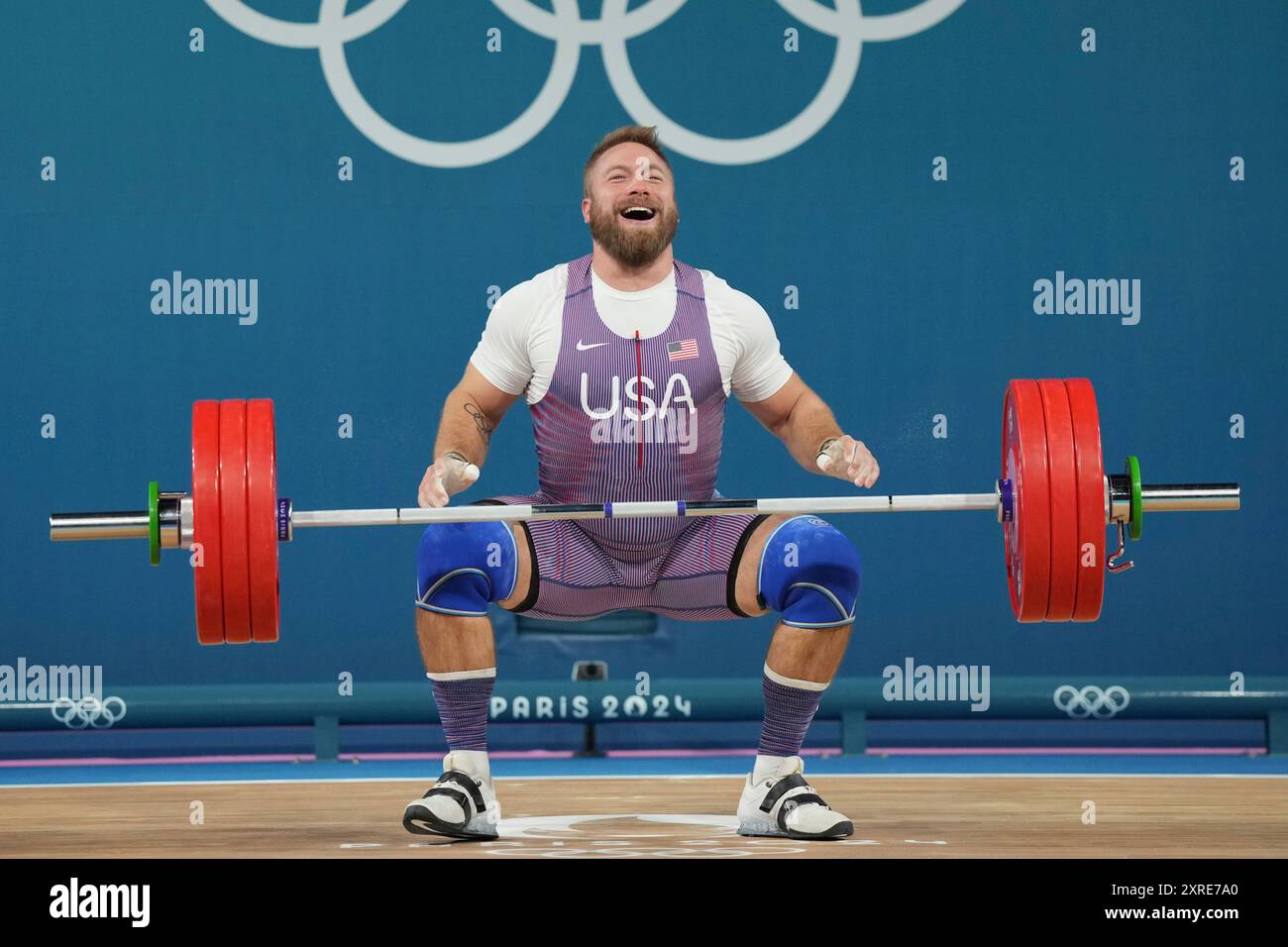 Wes Kitts of the United States reacts after a good lift during the men ...