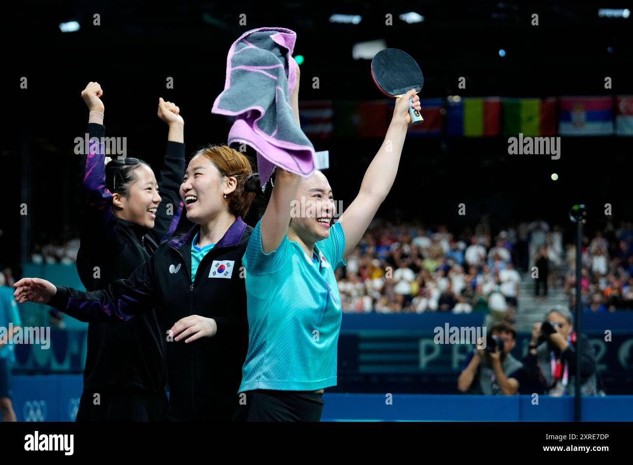 South Korea team celebrate after defeating Germany in the women's bronze medal team table tennis ...