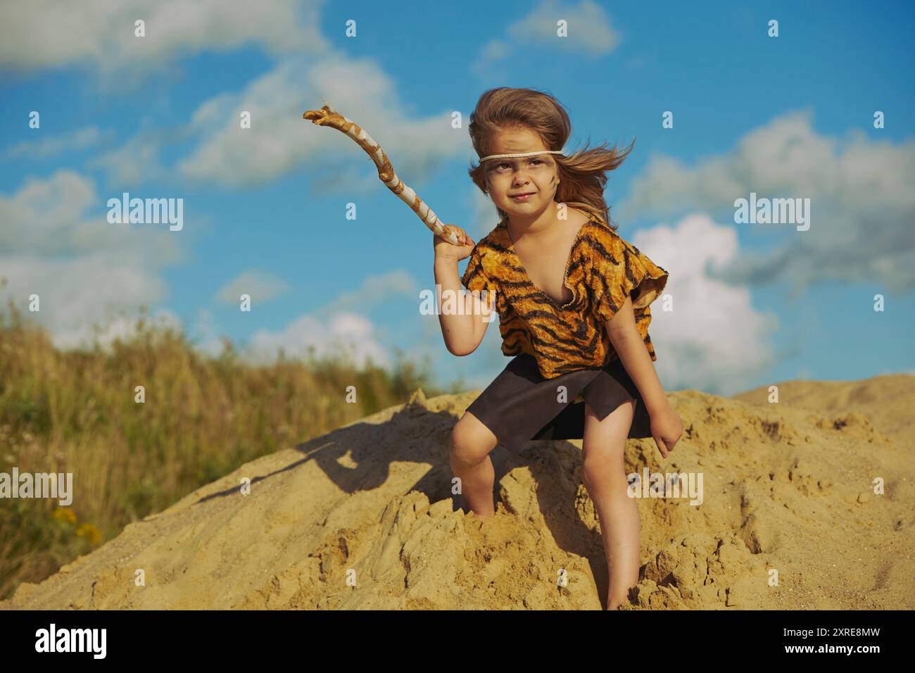 Cute baby dressed in the clothes of primitive people Stock Photo - Alamy