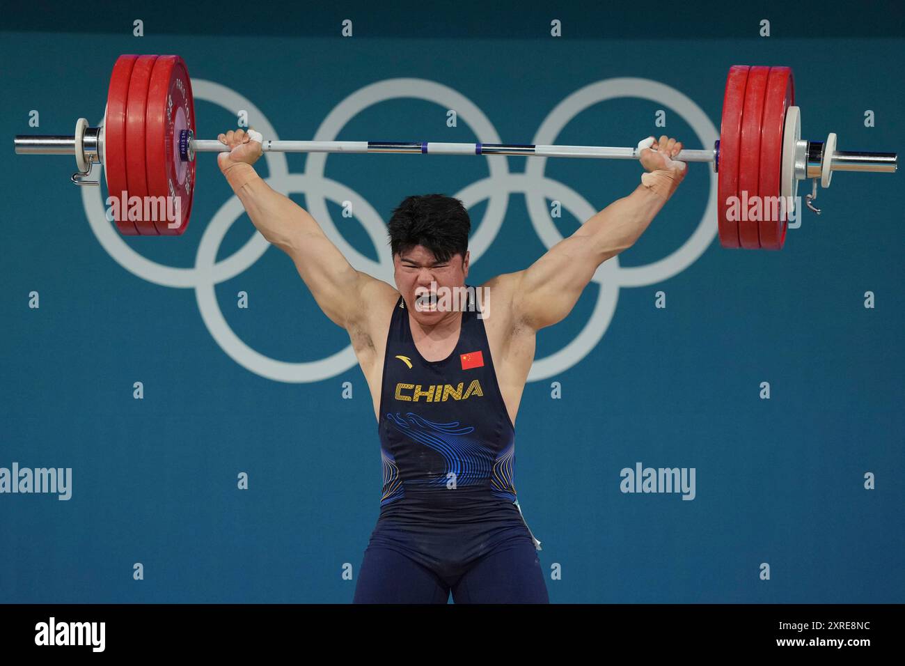 Liu Huanhua of China competes during the men's 102kg weightlifting ...