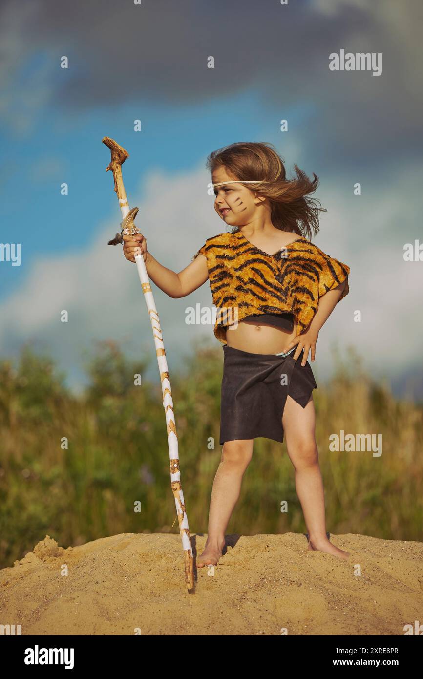 Cute baby dressed in the clothes of primitive people Stock Photo - Alamy