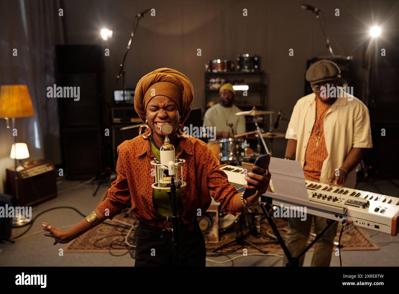 Group musicians tune instruments hi-res stock photography and images ...