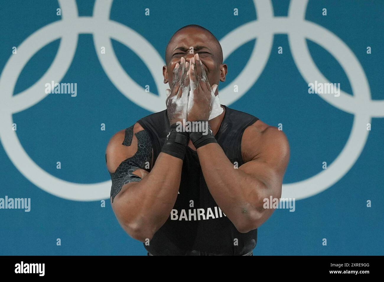 Lesman Montano of Bahrain reacts after a failed lift during the men's ...