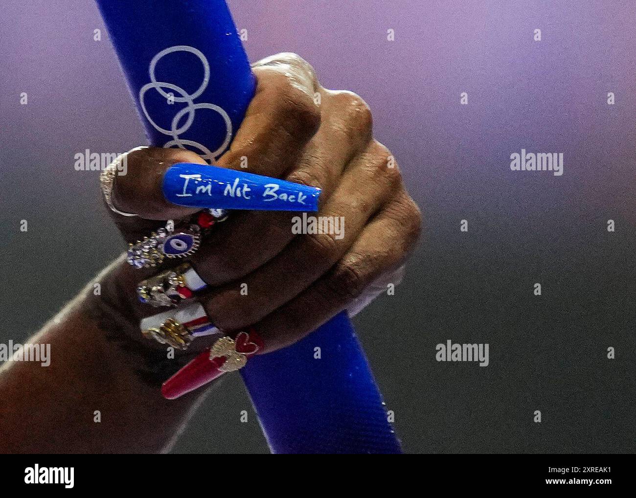 Sha'carri Richardson, of the United States, holds the baton after ...
