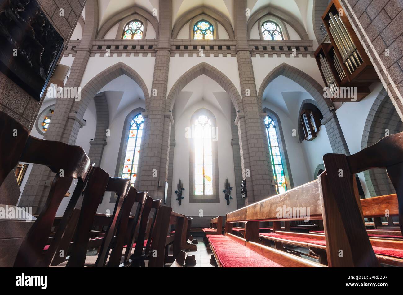 interior of a Christian Roman Catholic church with pews. Cathedral of ...